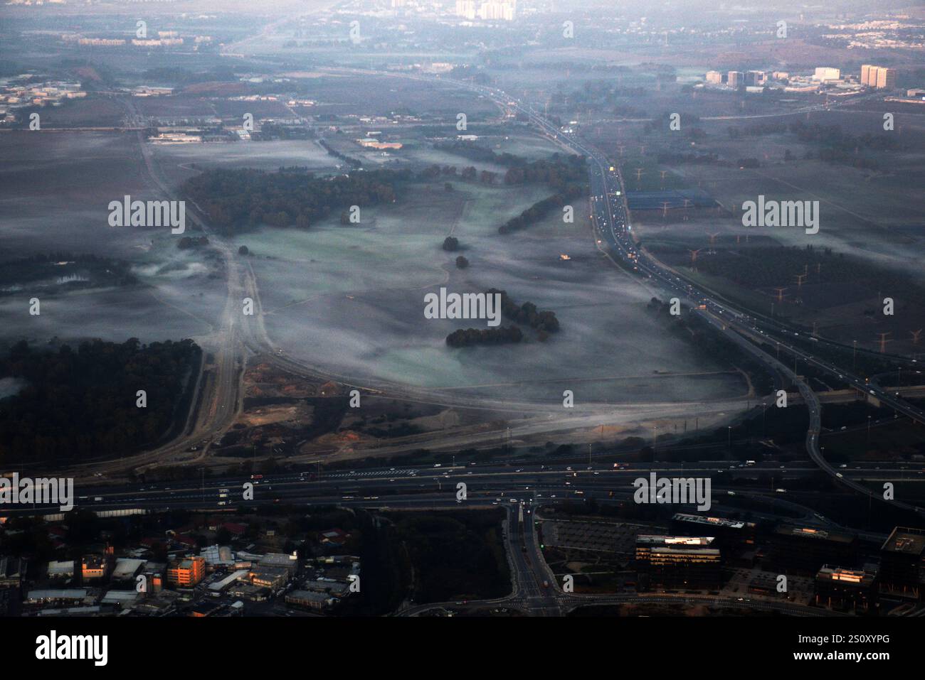 Aerial views of early morning mists over farmlands in the Sharon plain ...