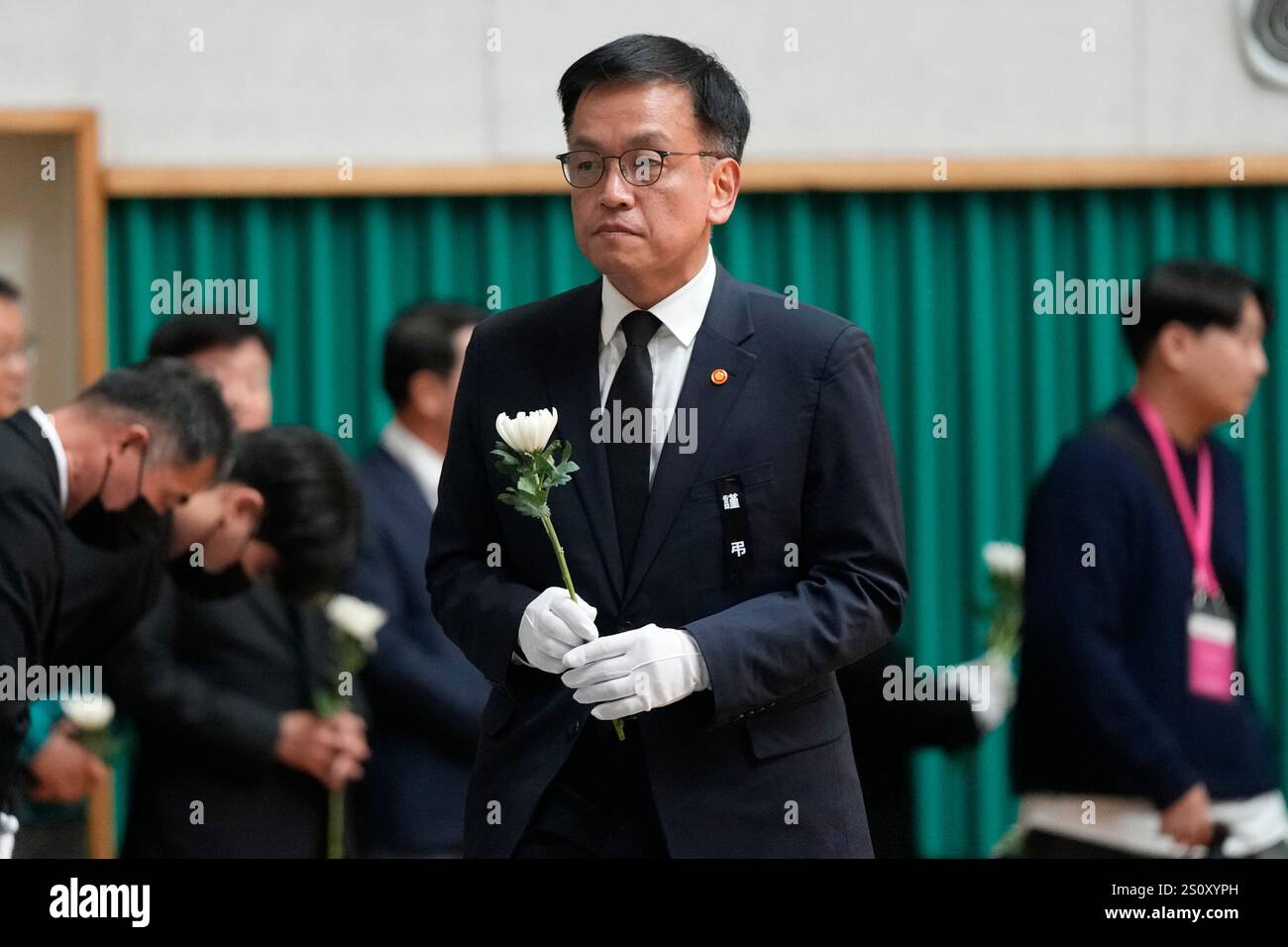 South Korea's acting President Choi Sang-mok arrives to pray for the victims on a plane which ...