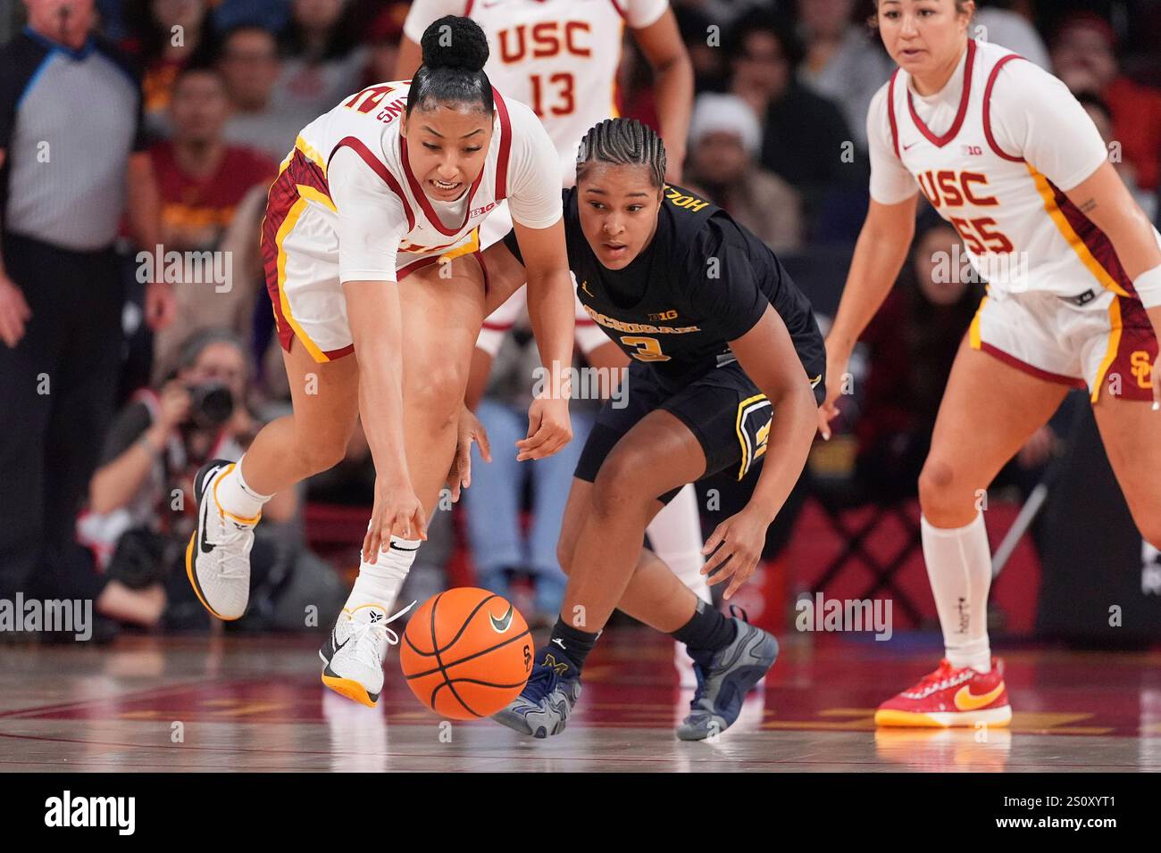 Southern California guard JuJu Watkins, left, and Michigan guard Mila ...