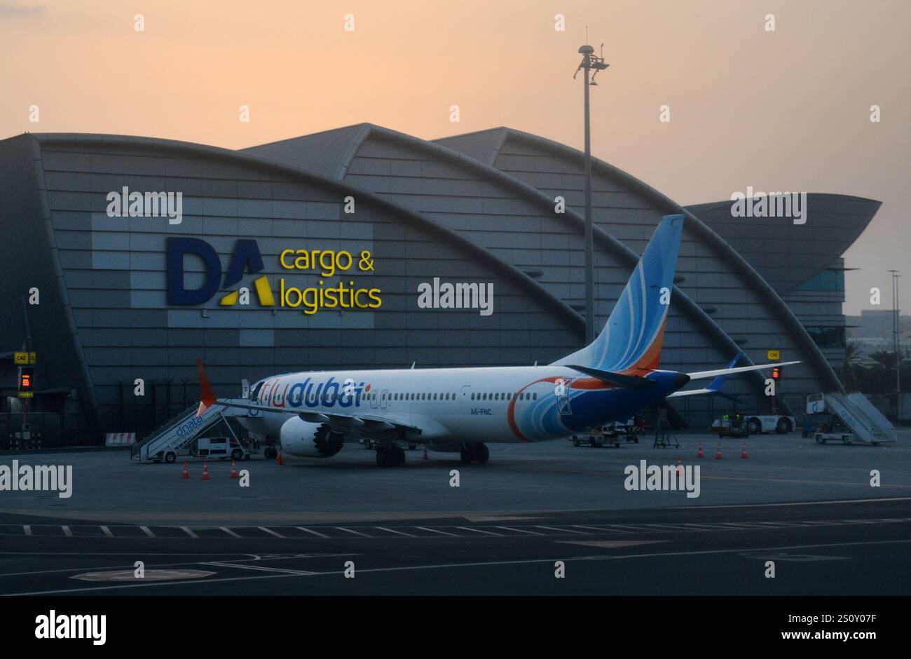 A Fly Dubai airplane by the DA Cargo & logistics terminal at Dubai ...