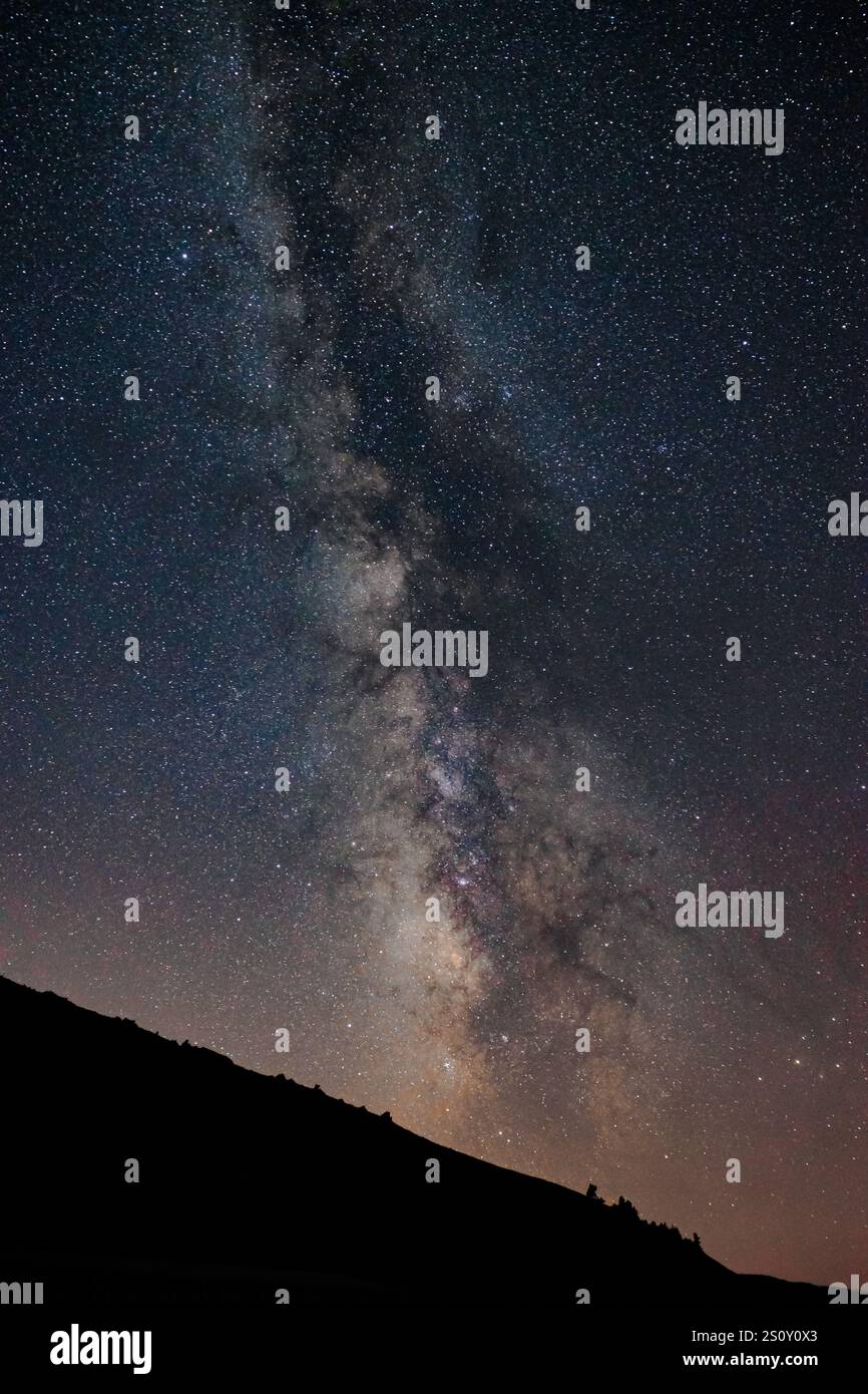 The Milky Way and silhouette of the hill. Starry night background ...