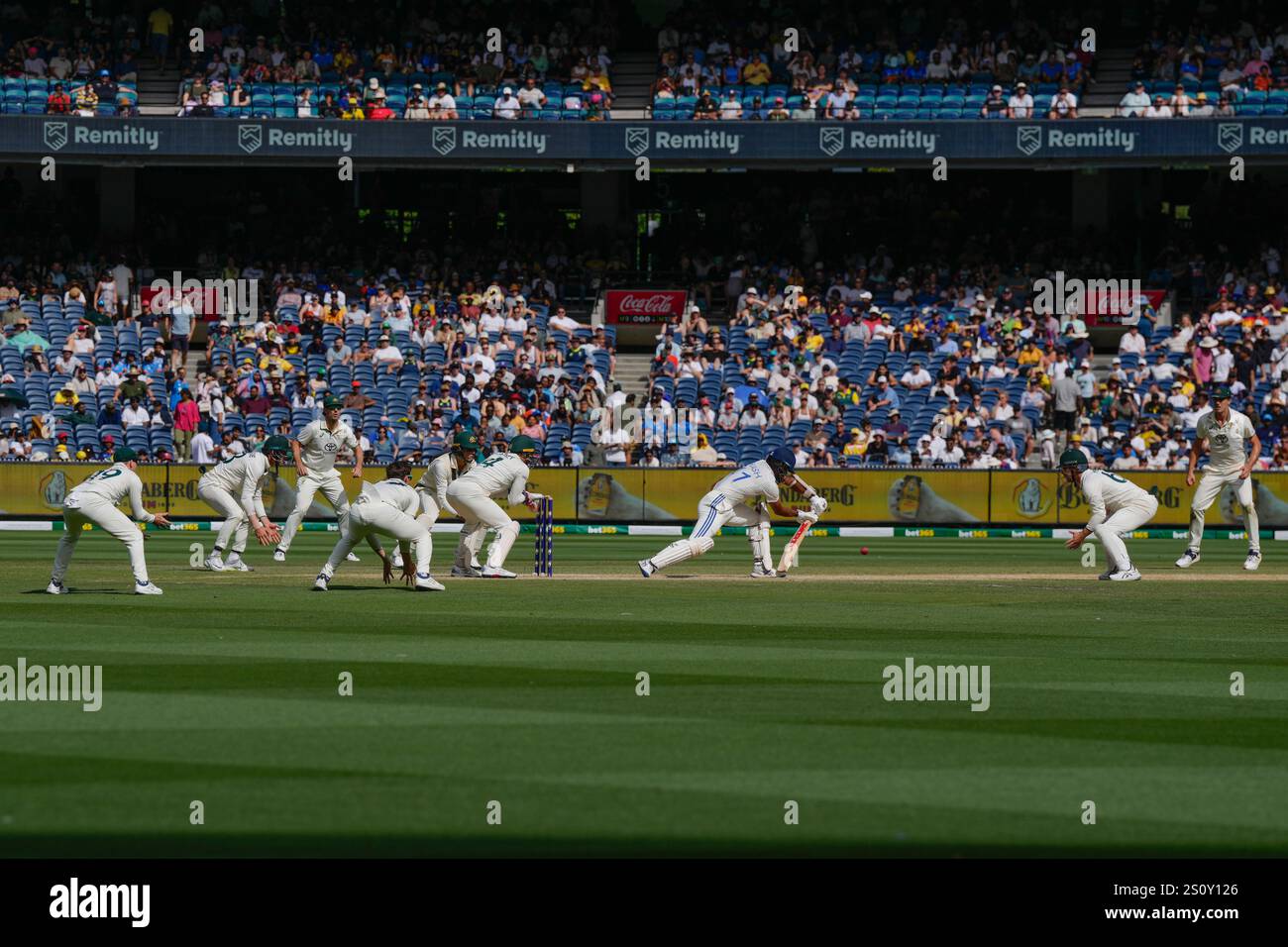 India's Akash Deep, third right, bats during play on the last day of ...
