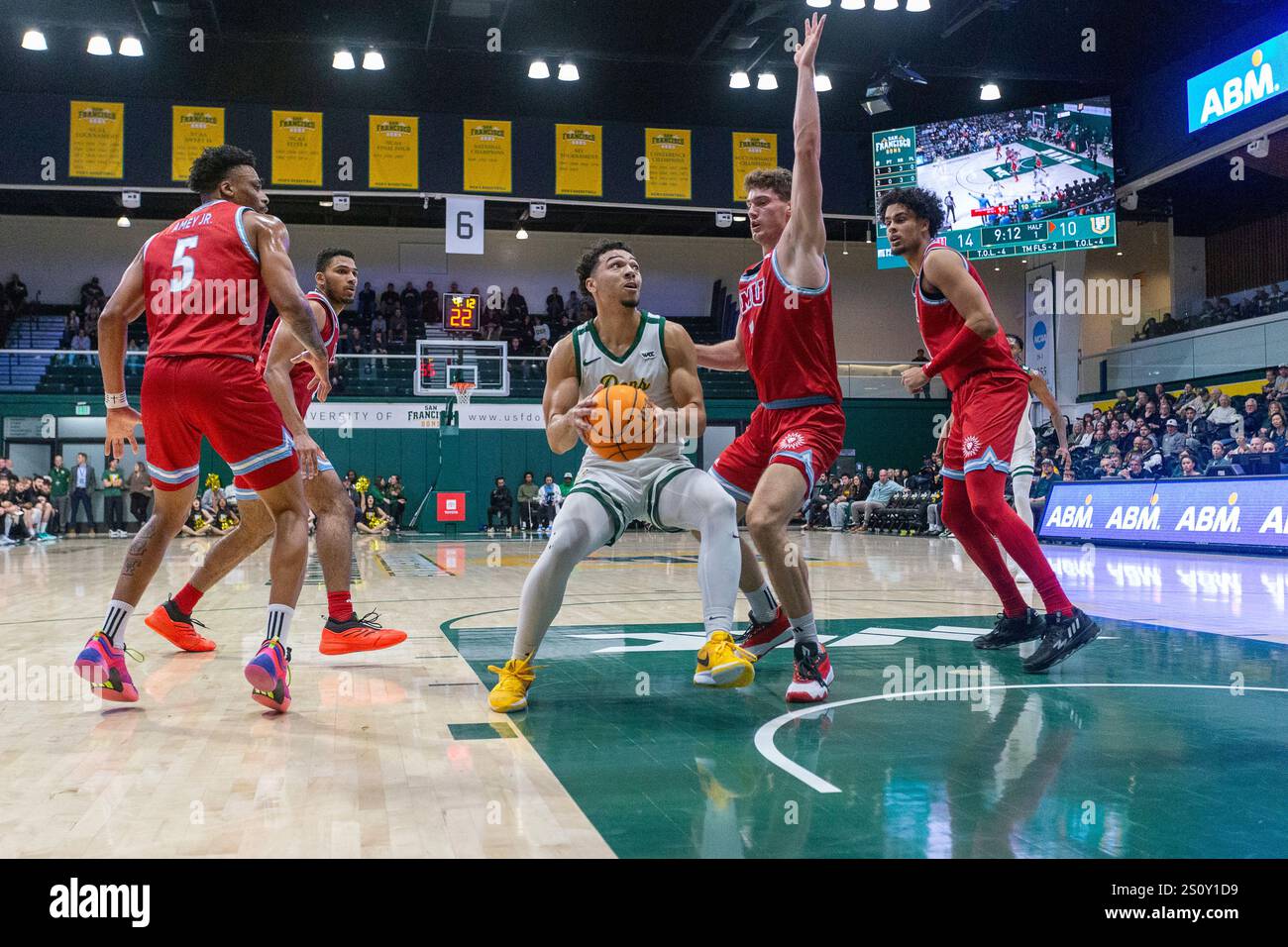 SAN FRANCISCO, CA - DECEMBER 28: USF Dons G Marcus Williams (55) drives ...