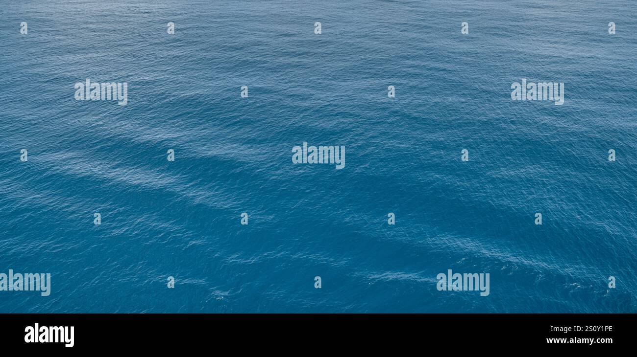 Calm ocean water surface texture background with gentle waves ripples ...