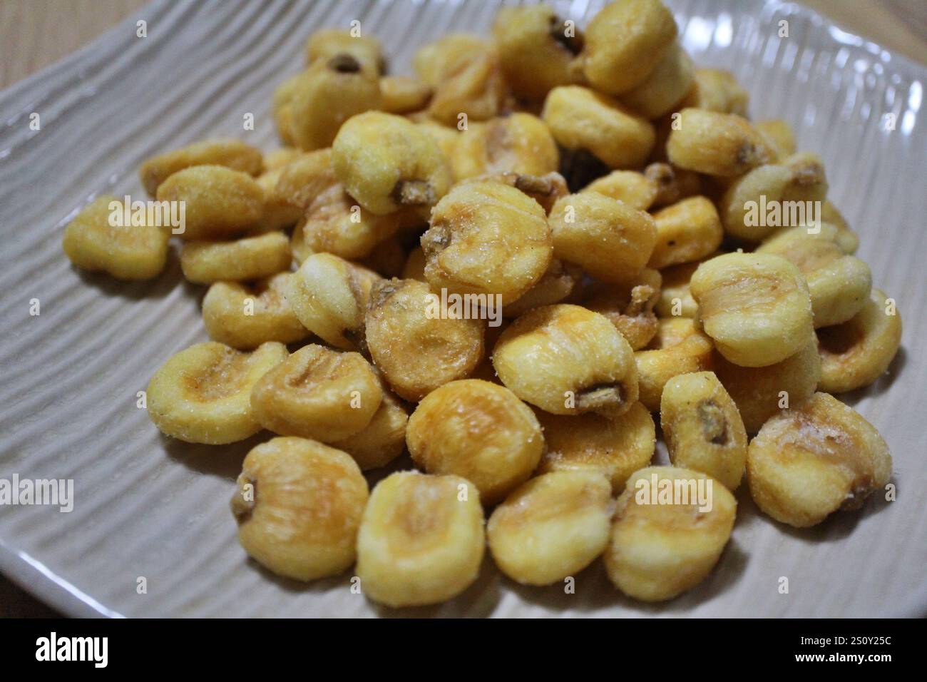Deep fried Peruvian corn snack Stock Photo - Alamy