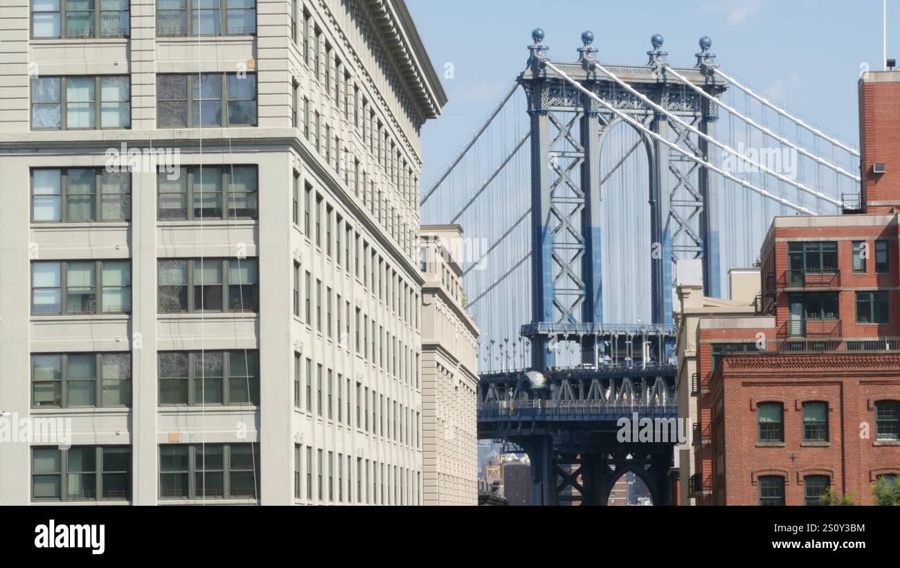 New York City Manhattan Bridge view from Brooklyn Bridge. Red brown ...