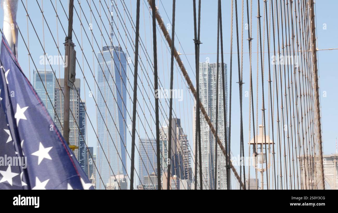 Flag on Brooklyn Bridge, Manhattan downtown, New York City skyline ...