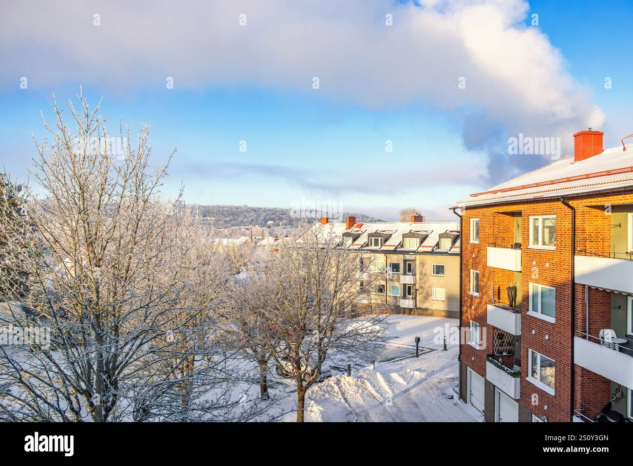 Apartment building with balconies a cold winter day with snow and ...