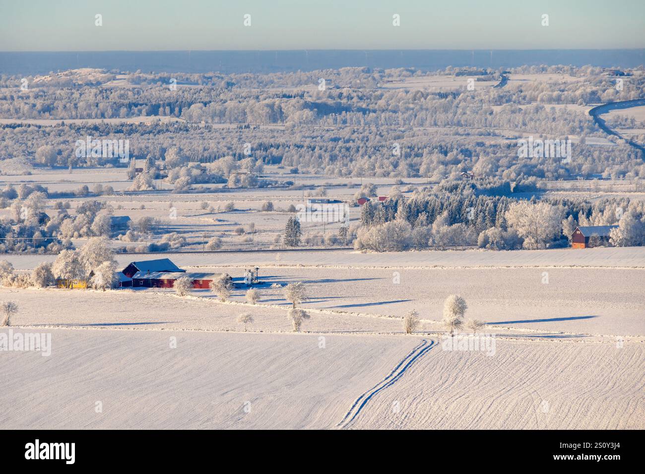 Aerial view at a winter landscape a farmstead in a snowy rural plain ...
