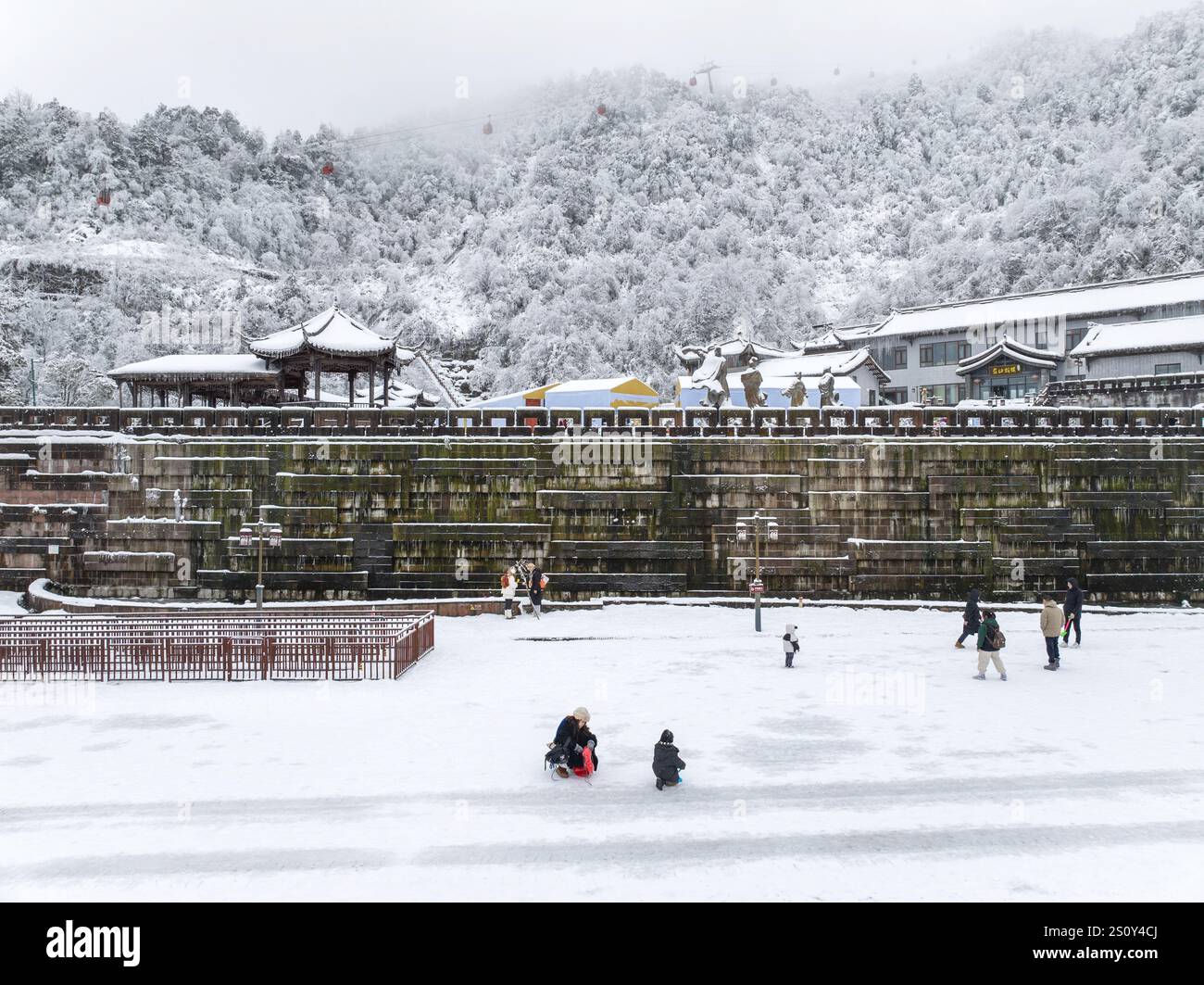 Tourists admire snow scenery at a forest park in Meishan City ...
