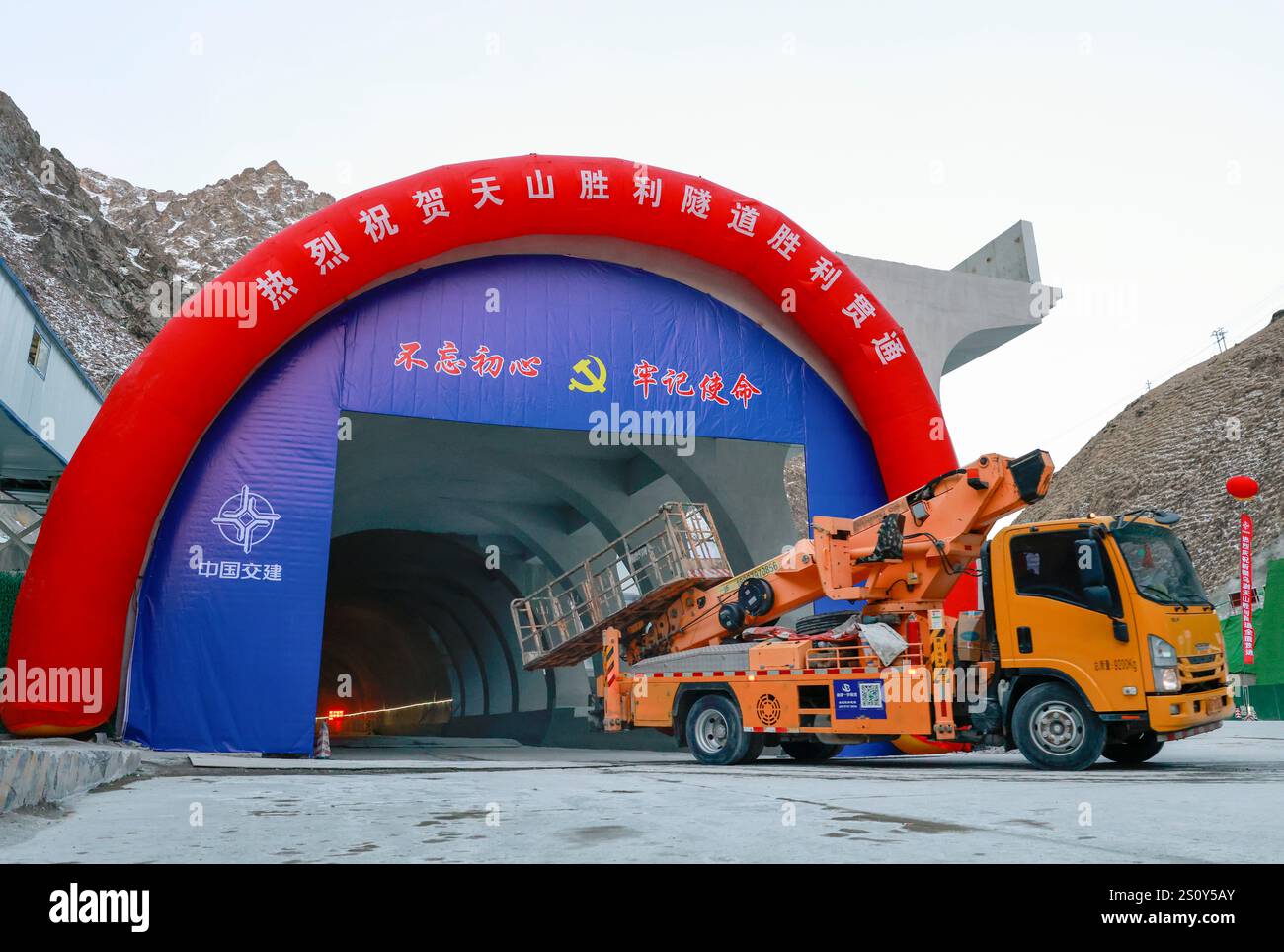 Urumqi. 30th Dec, 2024. A worker drives out of the Tianshan Shengli ...