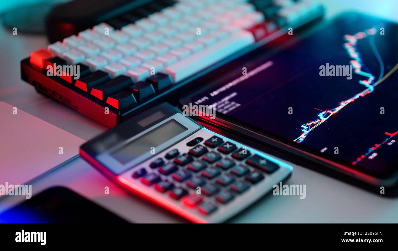 crypto currency exchange chart tablet screen calculator Stock Photo - Alamy