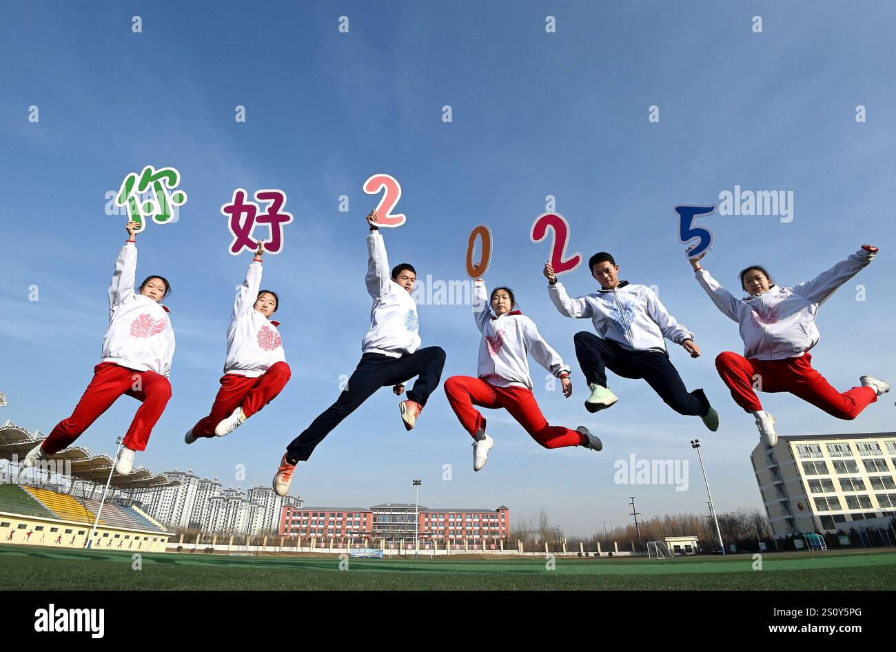 HANDAN, CHINA - DECEMBER 30, 2024 - Students holding cardboard reading ...