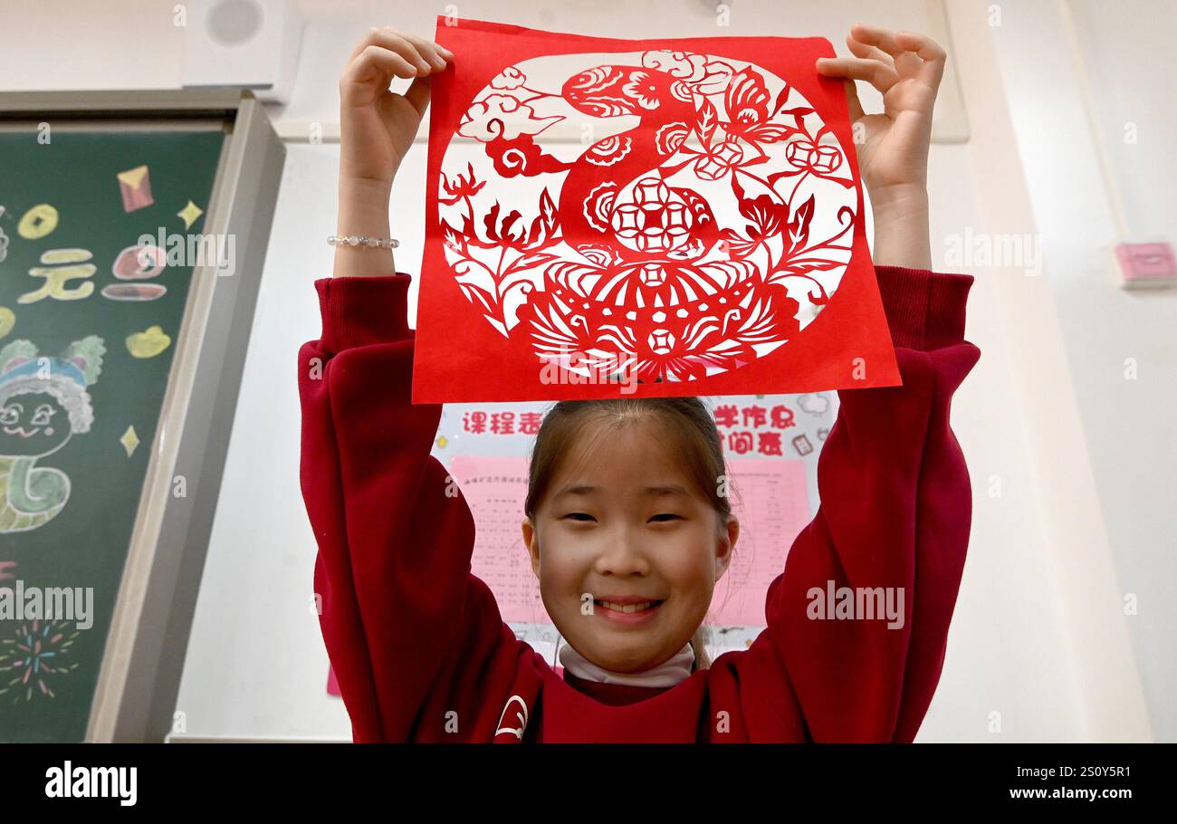 HANDAN, CHINA - DECEMBER 30, 2024 - Primary school students display ...