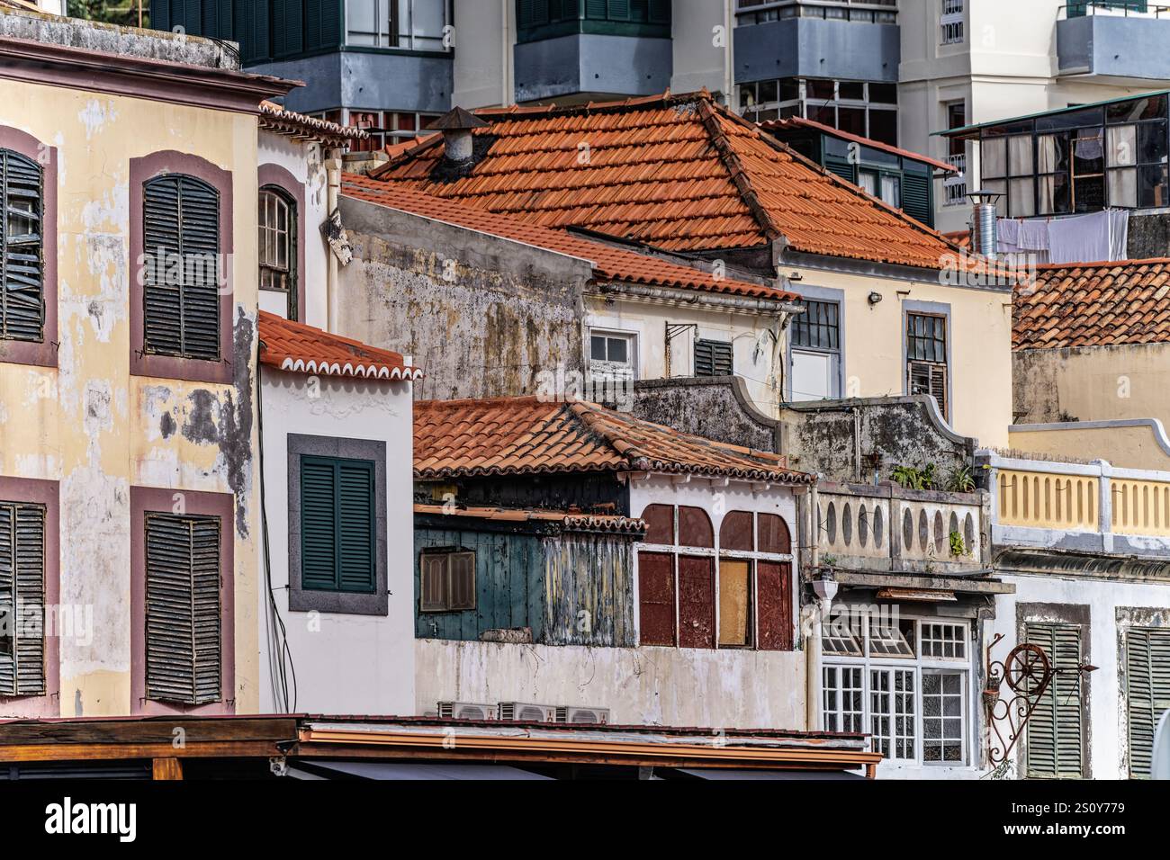 A charming depiction of an urban area featuring weathered buildings ...