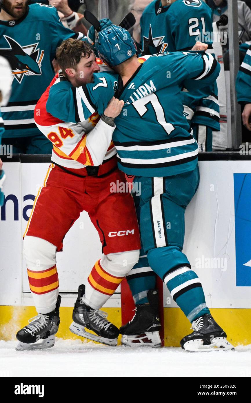 San Jose Sharks center Nico Sturm (7) and Calgary Flames defenseman ...