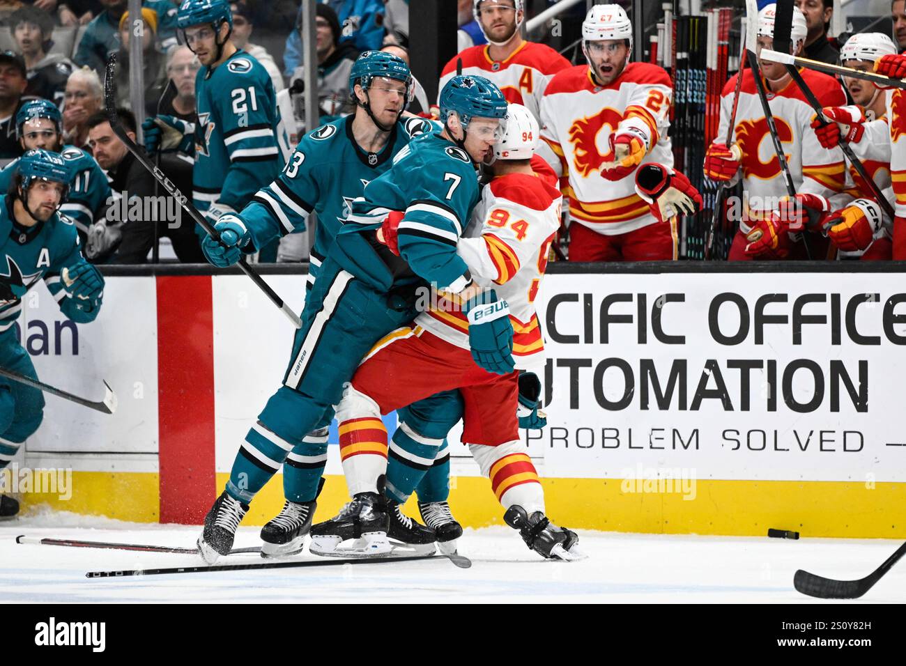 San Jose Sharks center Nico Sturm (7) and Calgary Flames defenseman ...