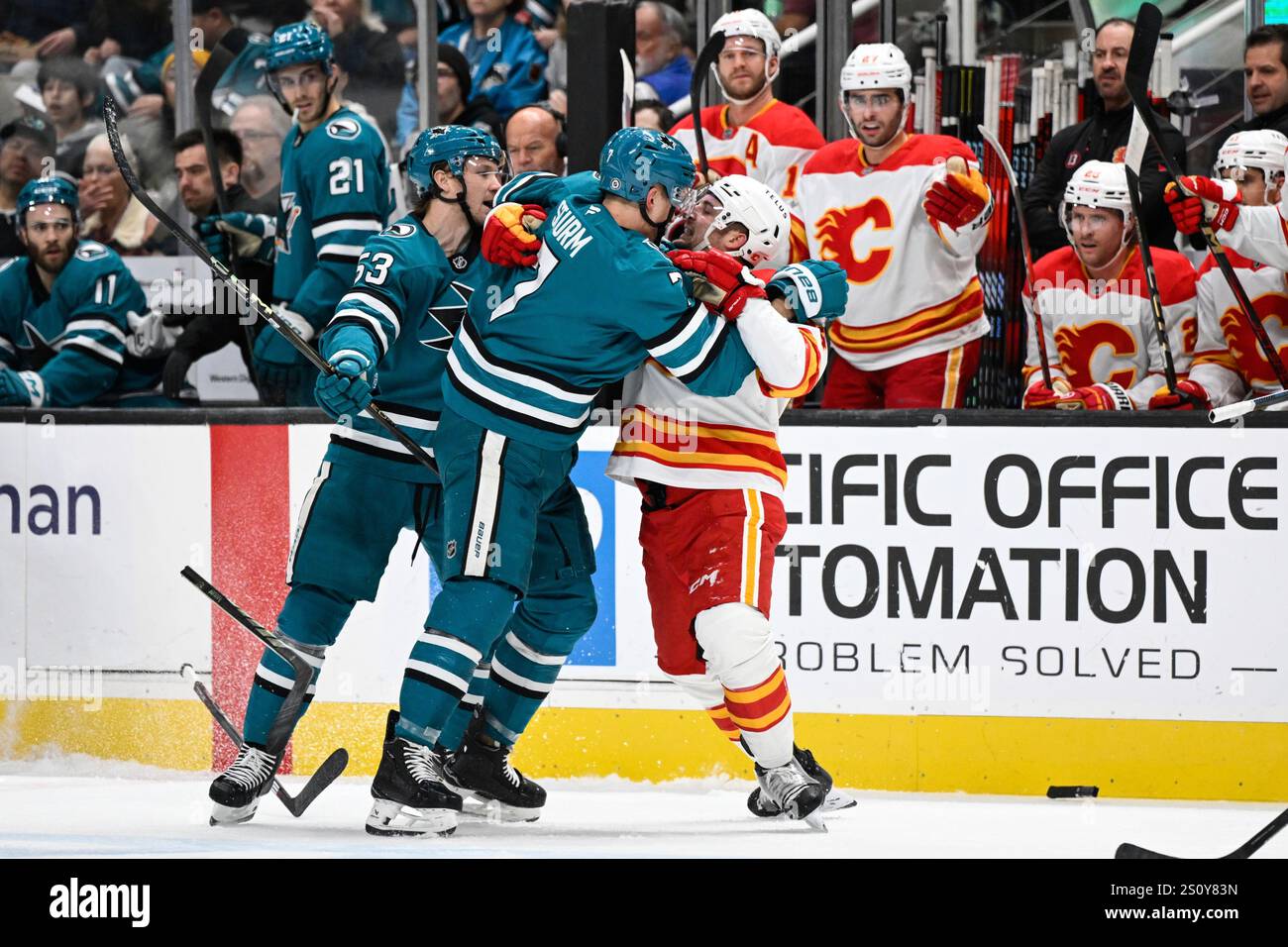 San Jose Sharks center Nico Sturm (7) and Calgary Flames defenseman ...