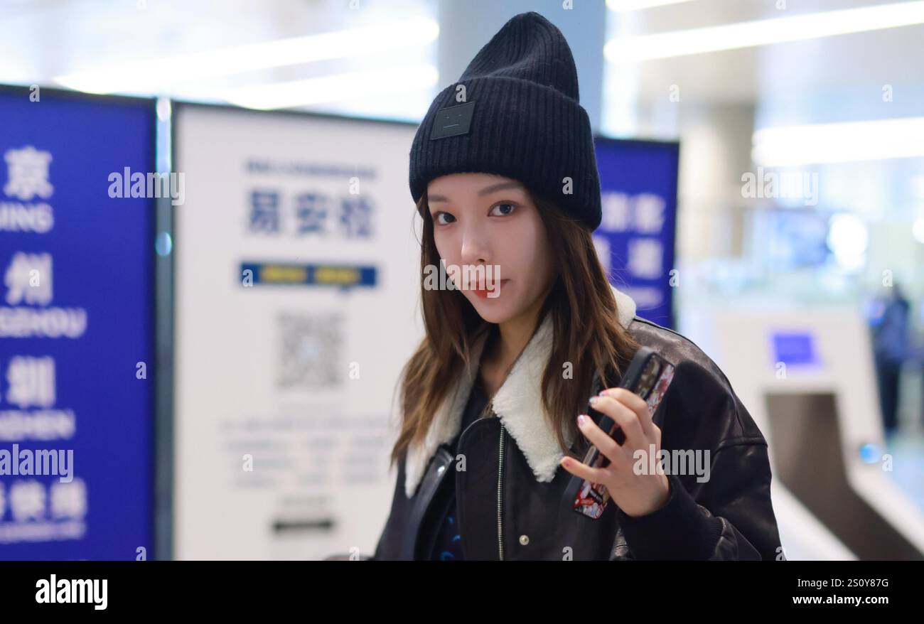 Chinese singer, dancer and actress Cheng Xiao appears at the airport in ...