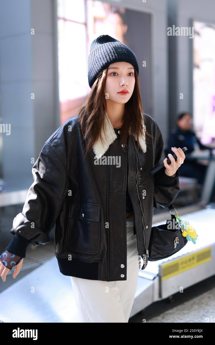 Chinese singer, dancer and actress Cheng Xiao appears at the airport in ...