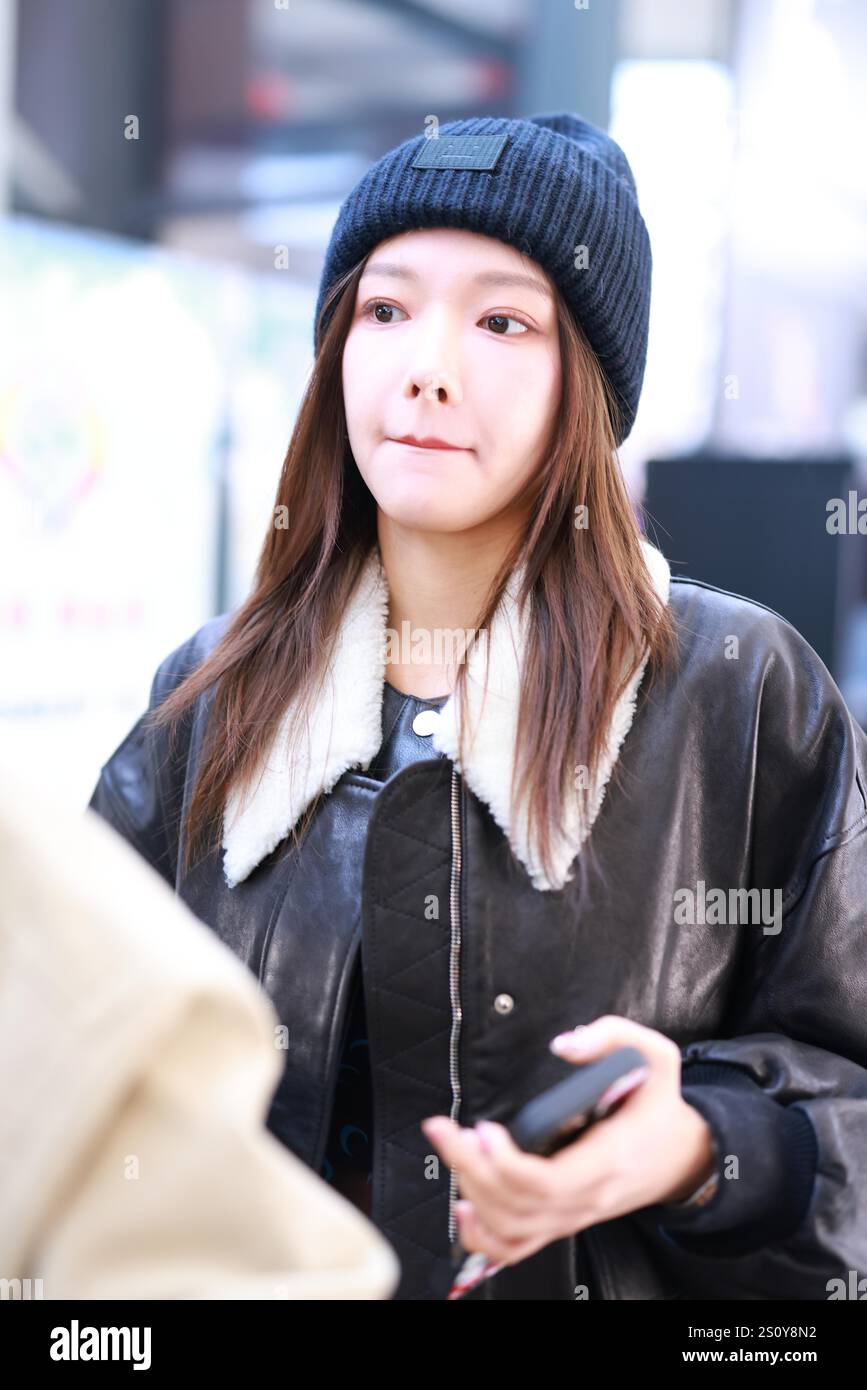 Chinese singer, dancer and actress Cheng Xiao appears at the airport in ...