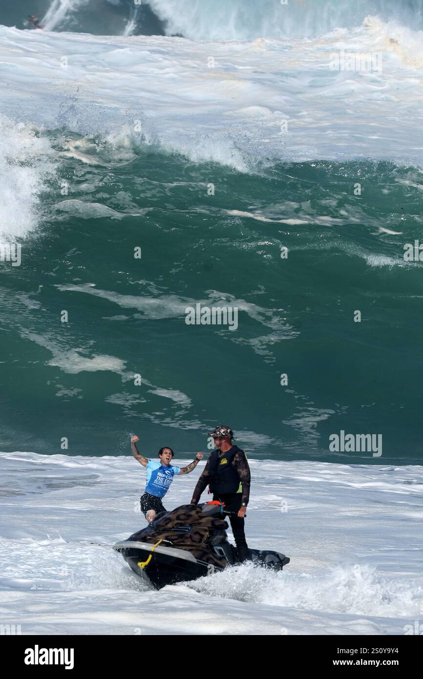 December 22, 2024, Waimea Bay, Haleiwa, Oahu, Hawaii, USA: Excited BILLY KEMPER, 34, surfing a ...