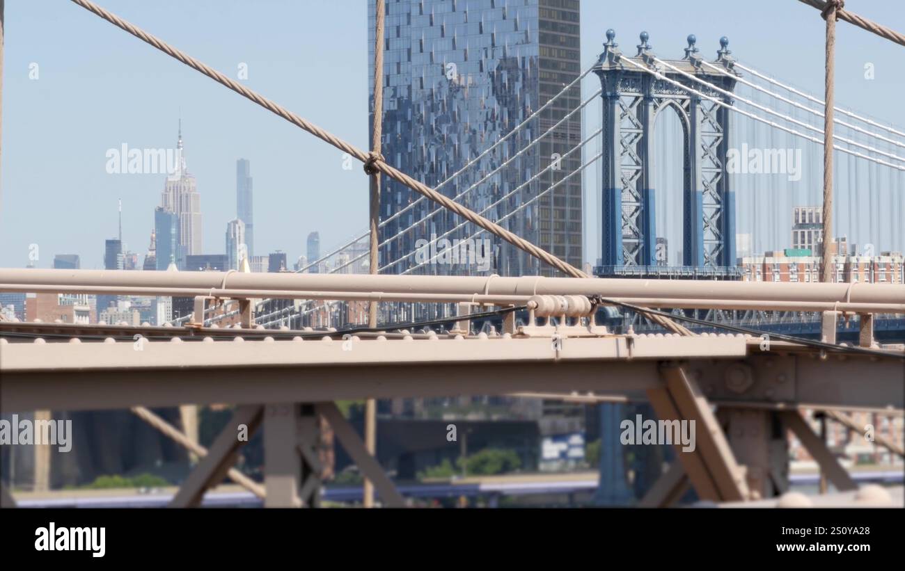 New York City Manhattan Bridge from Brooklyn Bridge view. Empire State ...