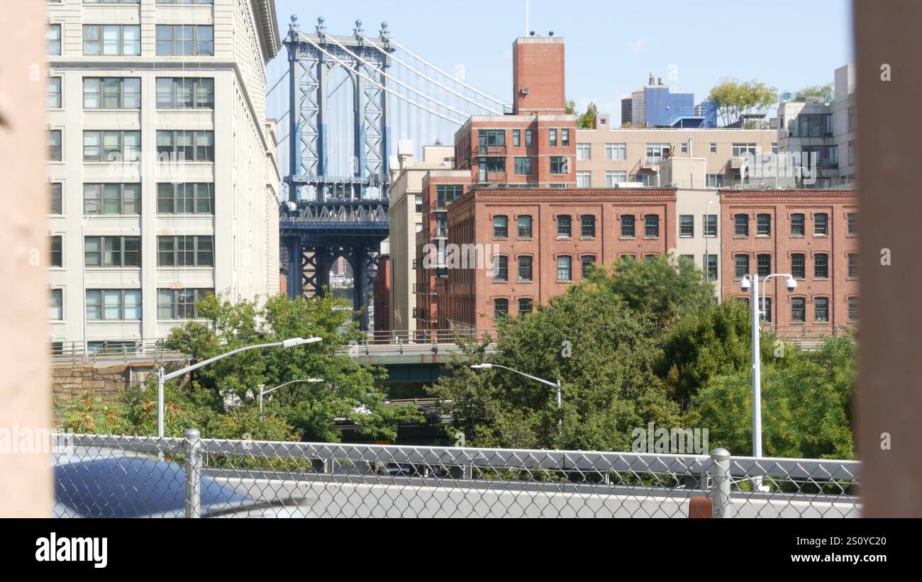 New York City Manhattan Bridge view from Brooklyn Bridge. Red brown ...