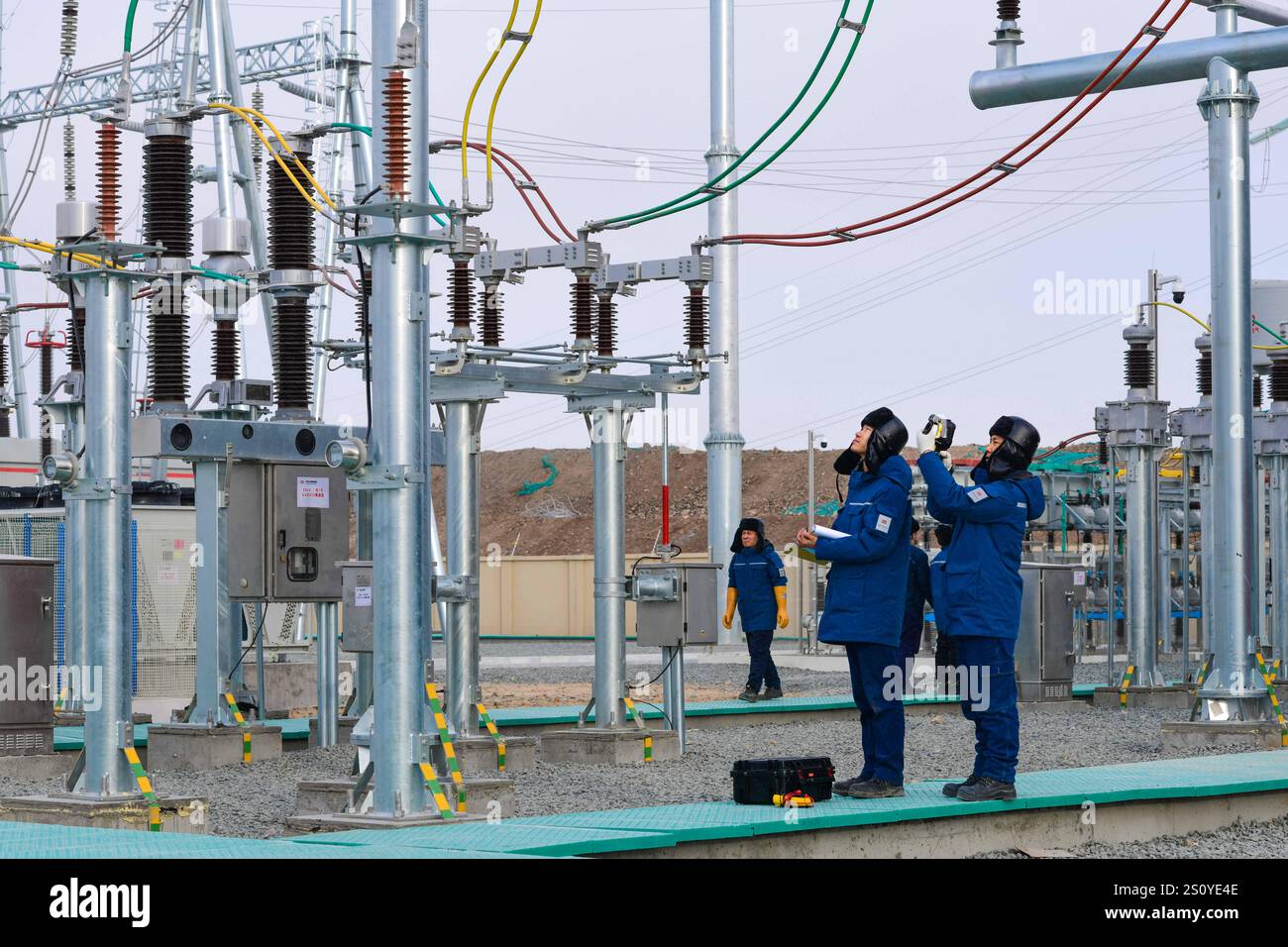 Operation and maintenance personnel inspect equipment at the 500 kV ...
