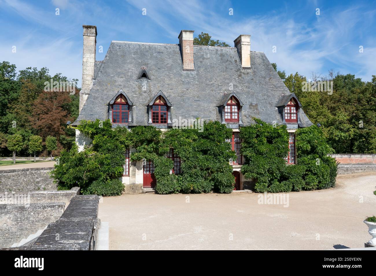 Old Traditional French House covered with common ivy (Hedera Helix ...