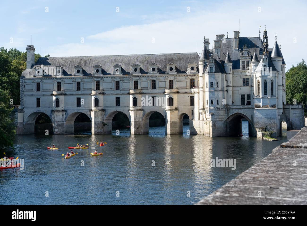 a magnificent white French chateau built on the river Cher, near ...