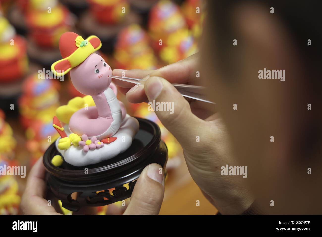 People make snake dough modellings in Linyi City, east China's Shandong ...