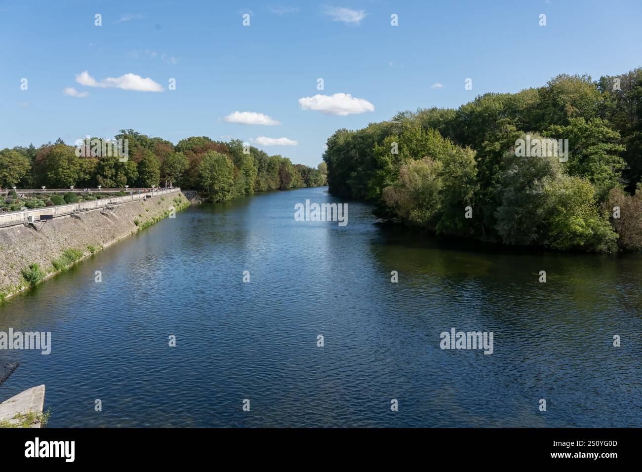 view along the river cher and garden wall of the Chateau de Chenonceau ...