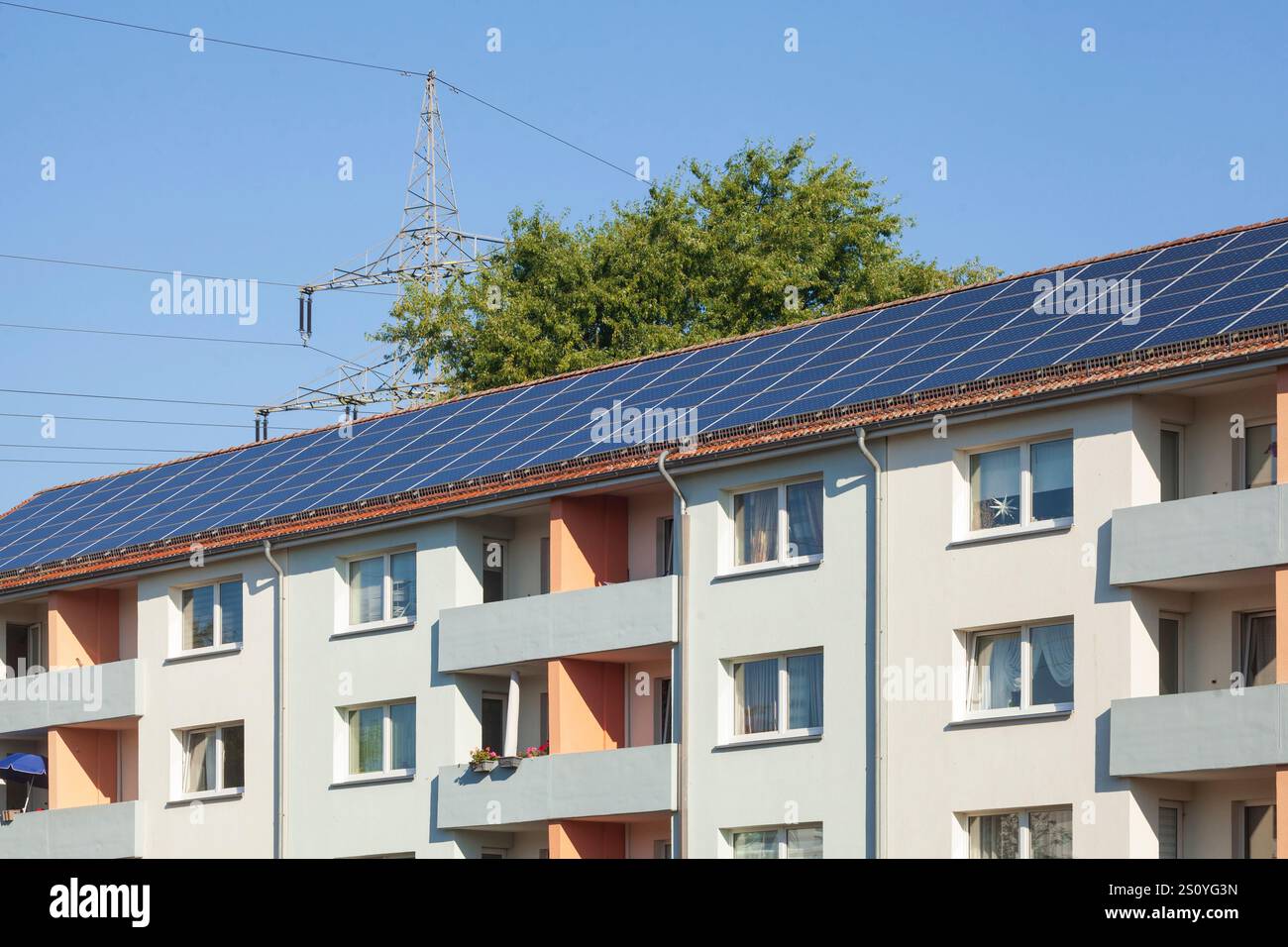 Monotonous modern residential building with solar roof and electricity ...