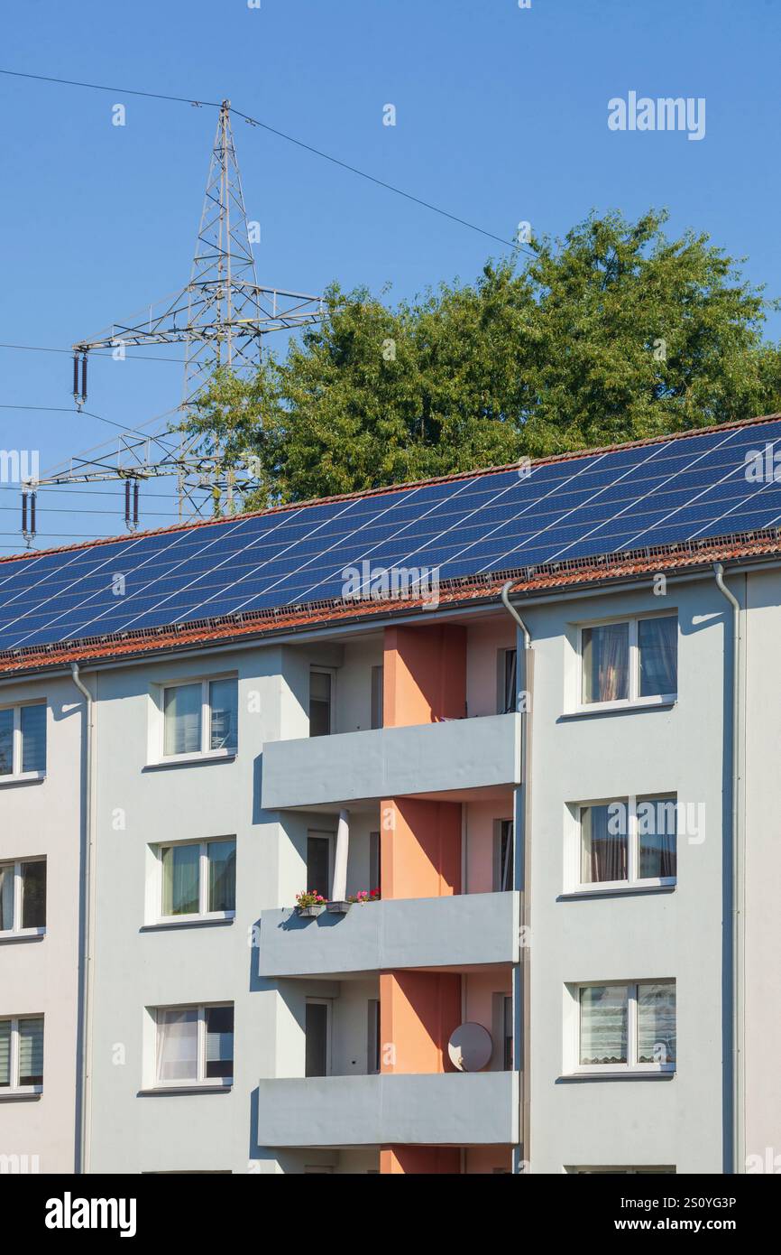 Monotonous modern residential building with solar roof and electricity ...