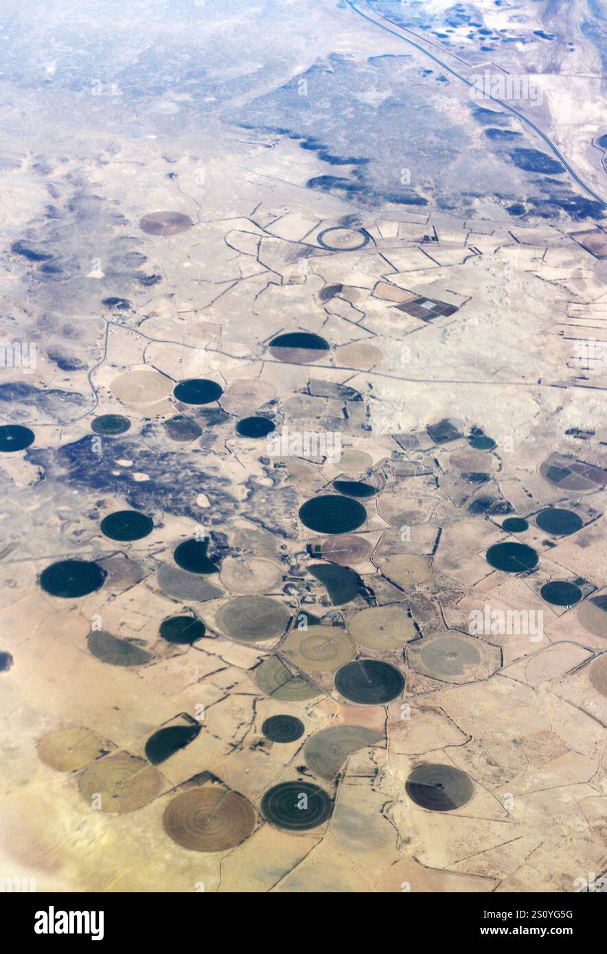 Aerial view of circular agriculture fields in the Arabian desert in ...
