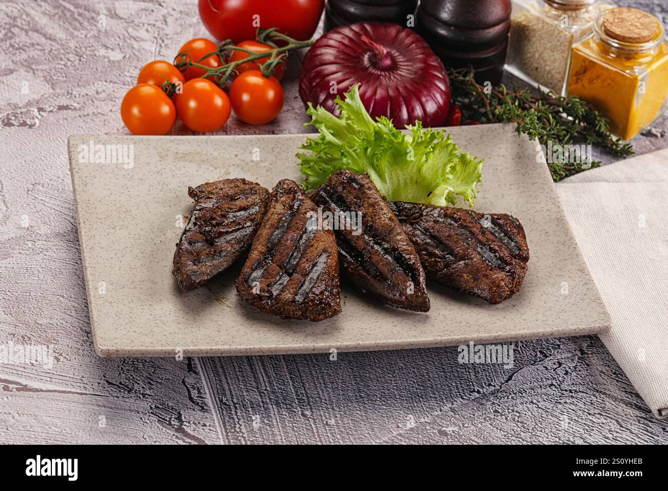 Grilled diet beef liver steak in the plate Stock Photo - Alamy