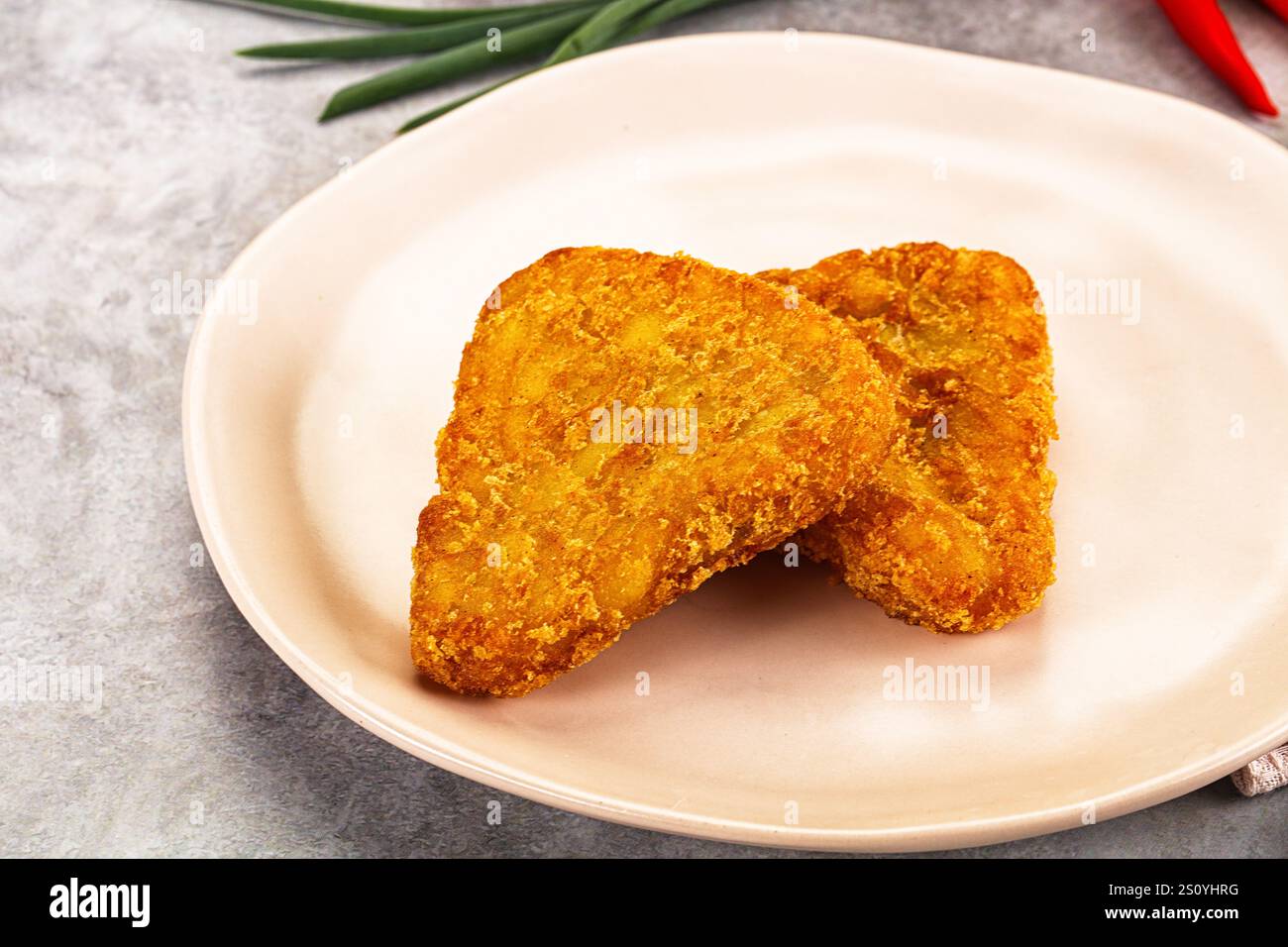 Fried potato hash brown snack for breakfast Stock Photo - Alamy