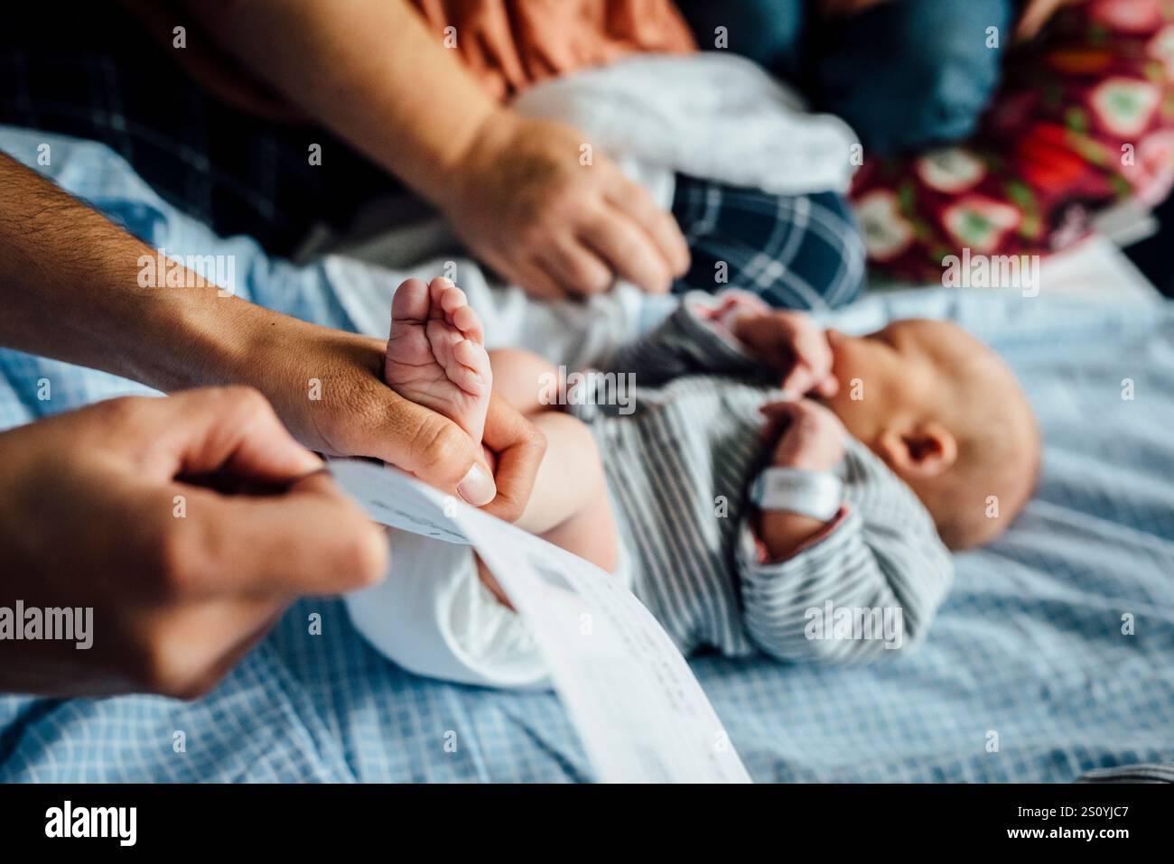 Newborn baby getting footprint done at hospital Stock Photo - Alamy