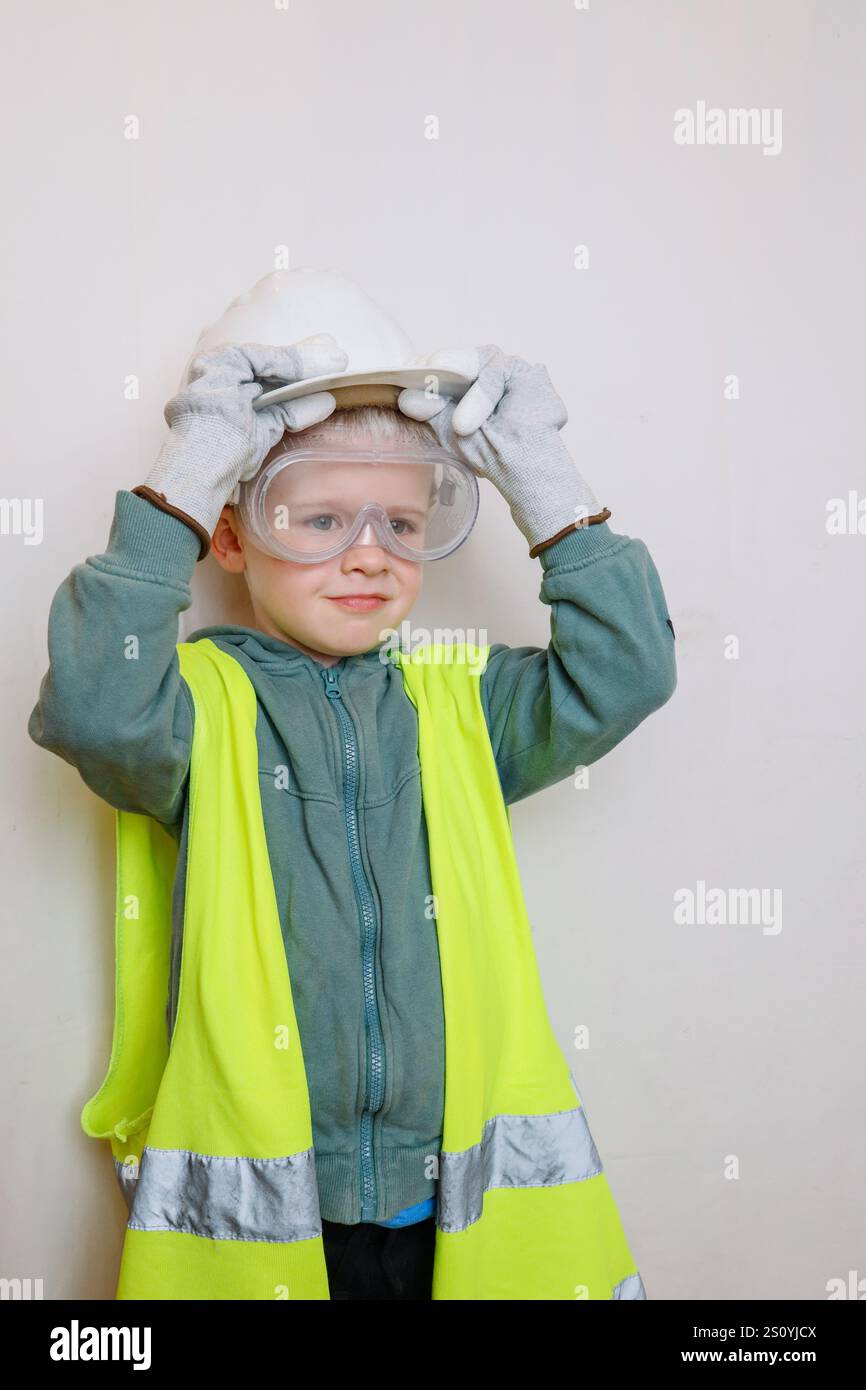 Child role-playing as a construction worker Stock Photo - Alamy