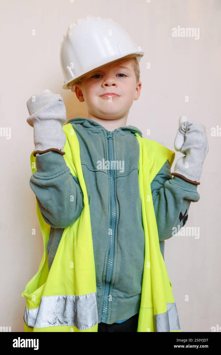 Child role-playing as a construction worker Stock Photo - Alamy