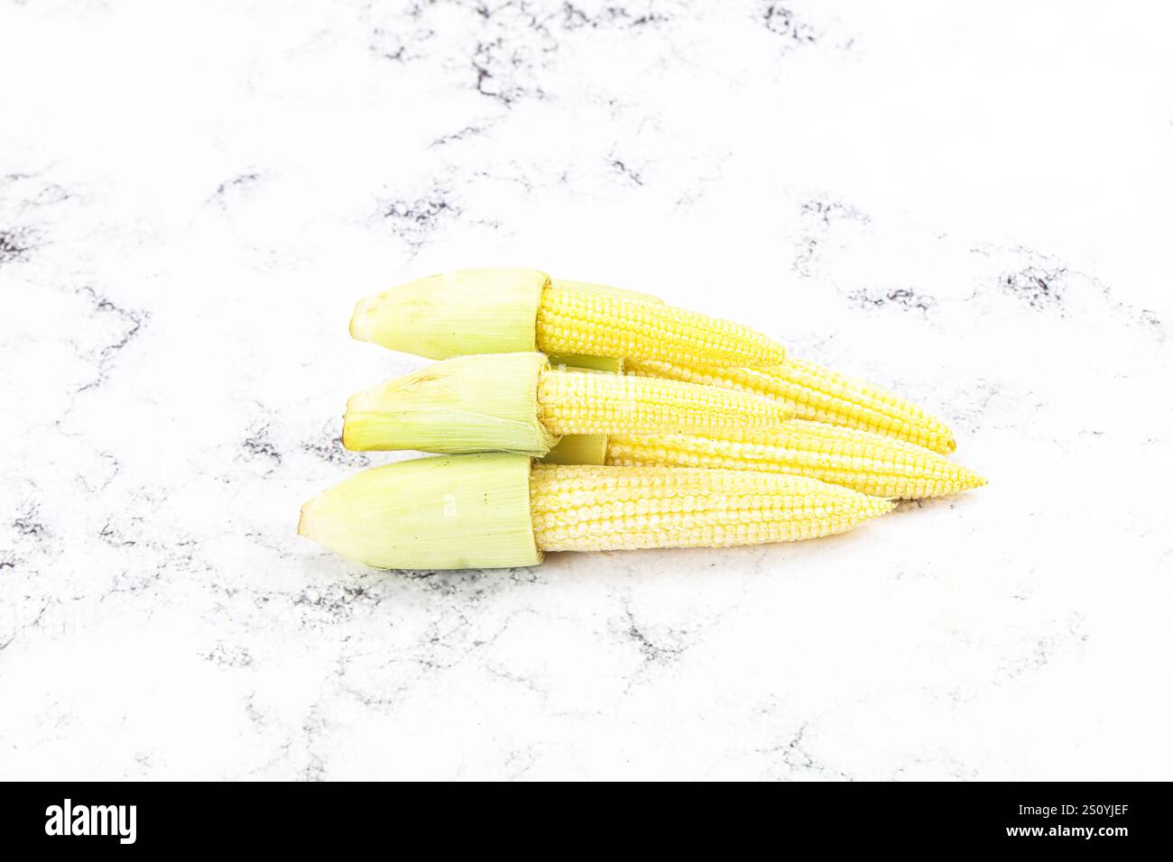 Small young sweet baby corn heap Stock Photo - Alamy