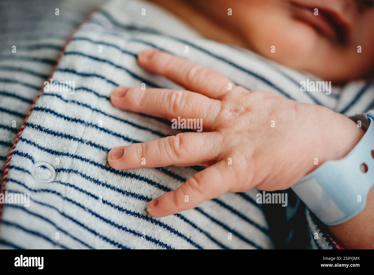 Newborn baby hand fingers close up detail at hospital after birth Stock ...