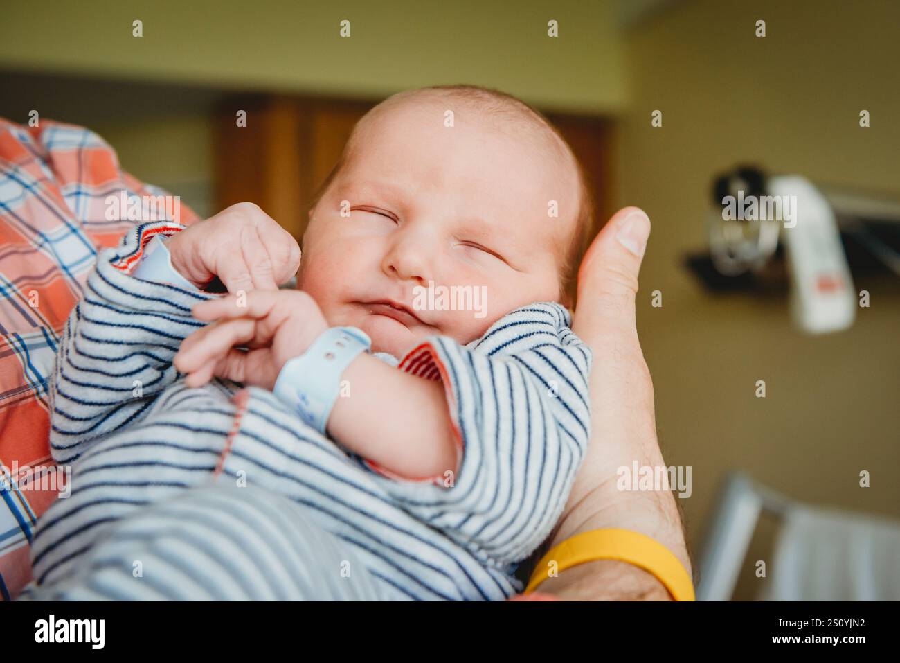 Dad holding newborn baby at hospital after birth Stock Photo - Alamy