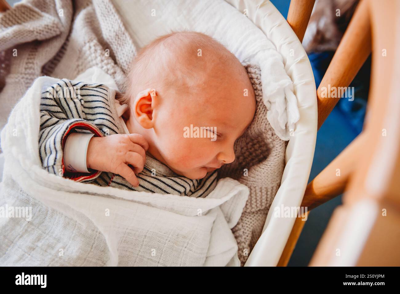 Newborn baby sleeping in hospital crib bassinet after birth Stock Photo ...