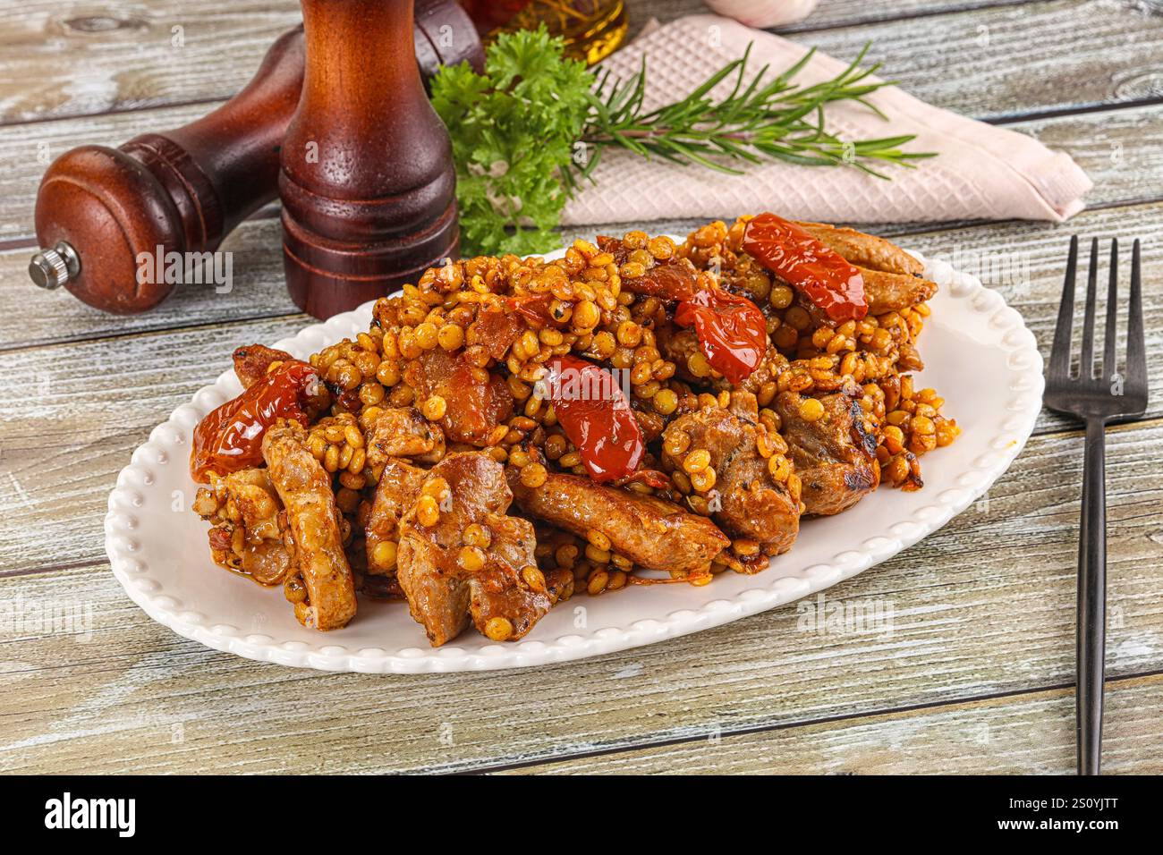 Rasted chicken meat with ptitim and vegetables Stock Photo - Alamy