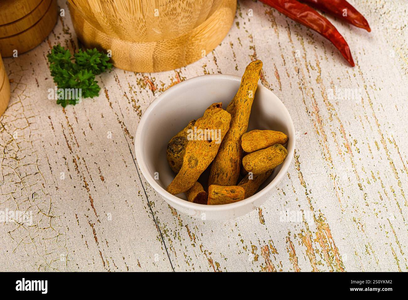 Raw dry Tumeric roots heap for culinary and medicine Stock Photo - Alamy