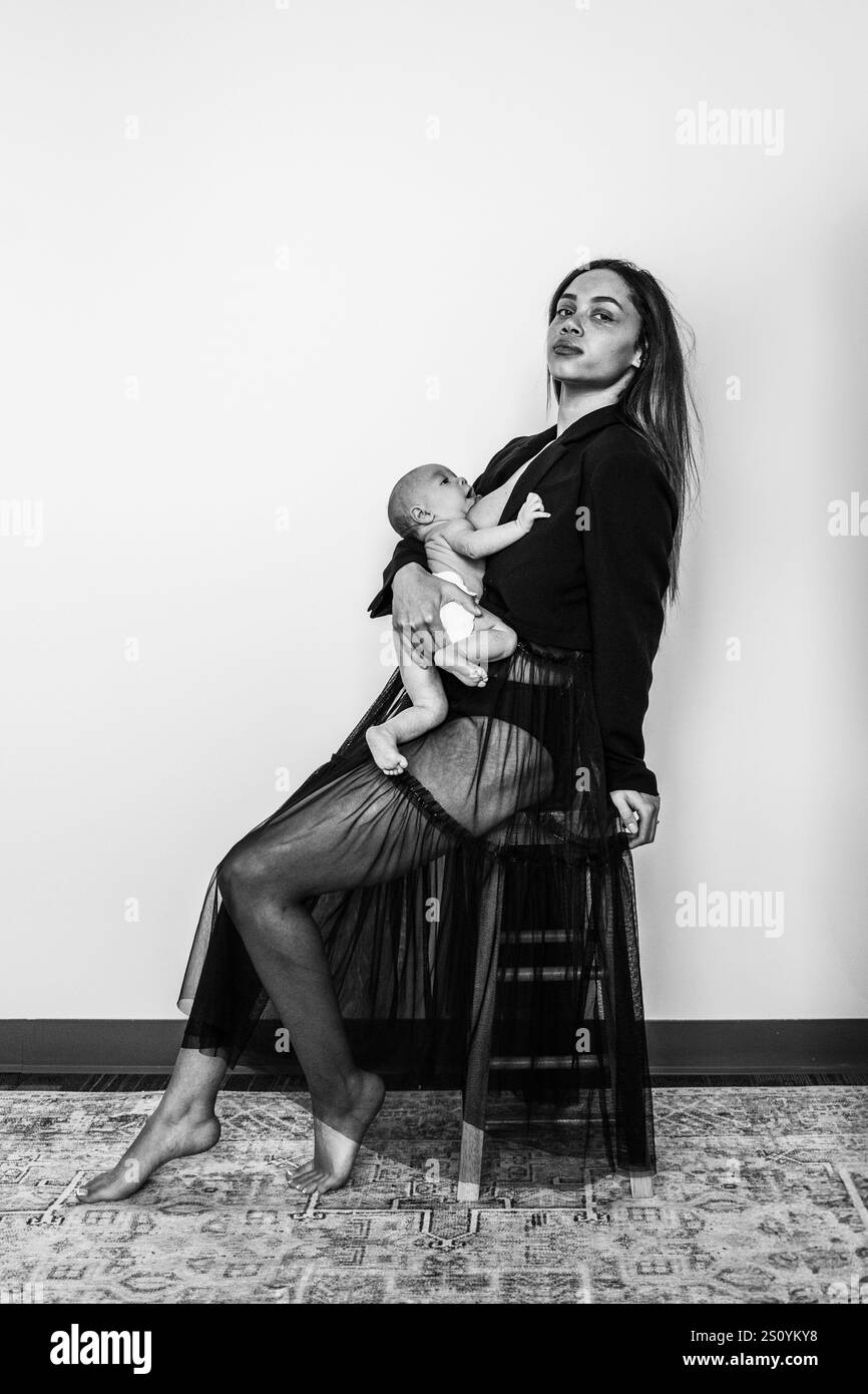 Mother holding a baby Black and White Stock Photos & Images - Alamy