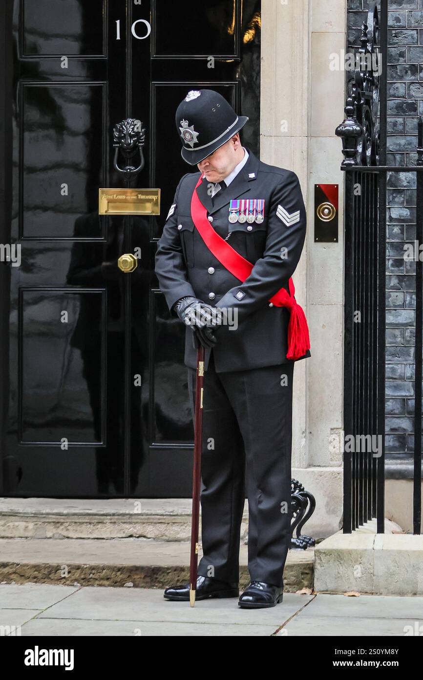 Metropolitan Police officer in ceremonial uniform and medals outside 10 ...