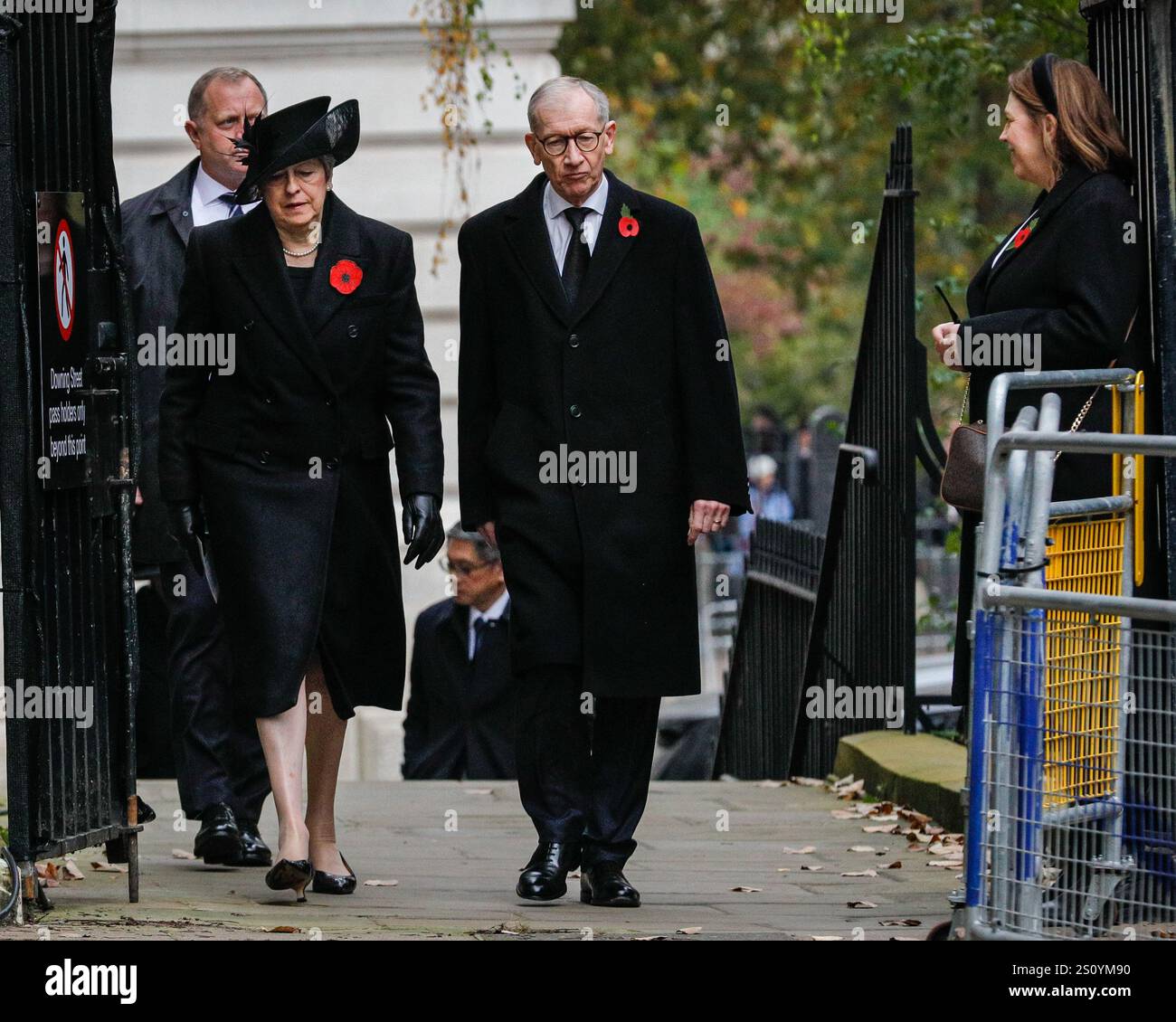 Theresa May, former Prime Minister of the United Kingdom walks with ...